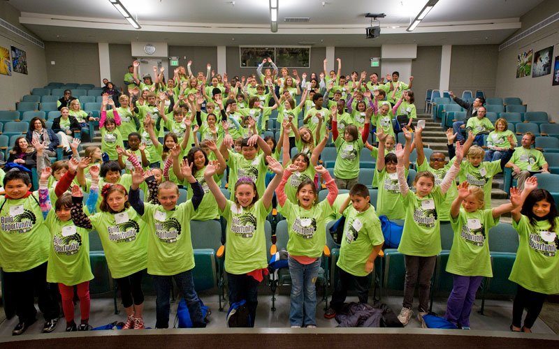 kids excited in auditorium - Modern Learners
